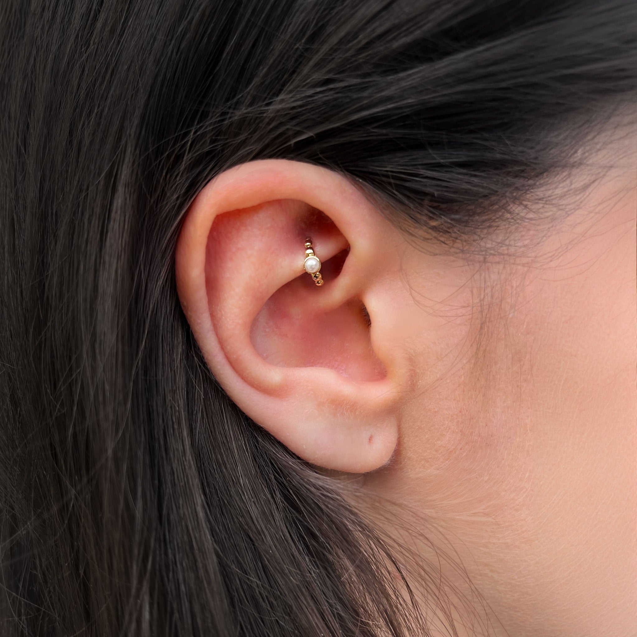 18k yellow gold piercing ring with continuous row of beads and pearl ...